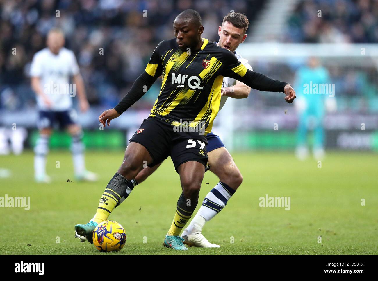 Watford's Edo Kayembe (left) and Preston North End's Ben Whiteman ...