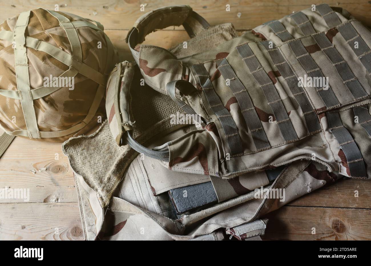 A military helmet of a Ukrainian soldier with a heavy bulletproof vest ...
