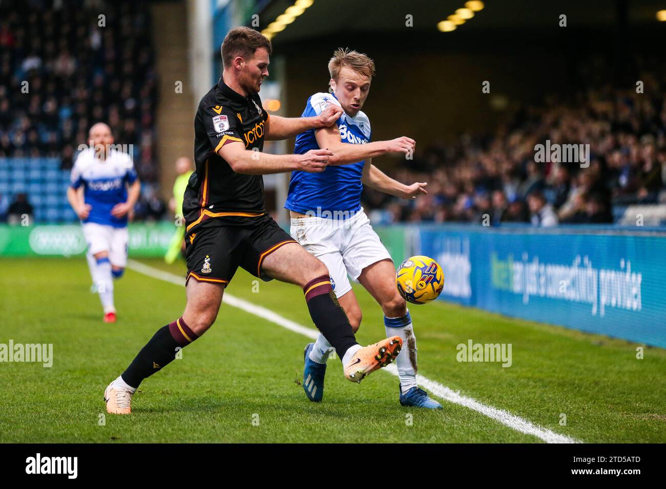 Gillingham's George Lapslie battles for the ball against Bradford City ...