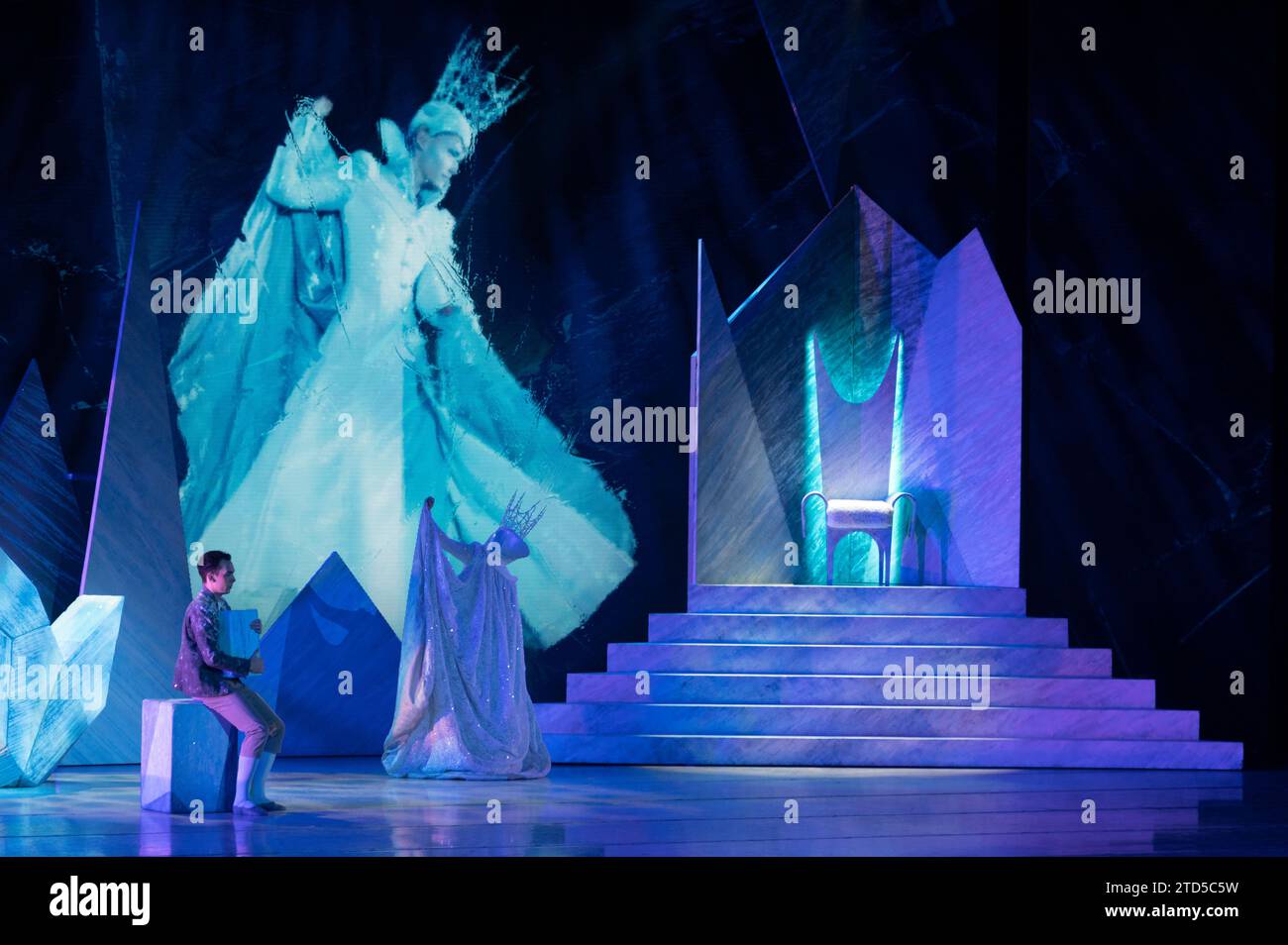 The wicked Snow Queen steps down from her throne with a backdrop of her ...