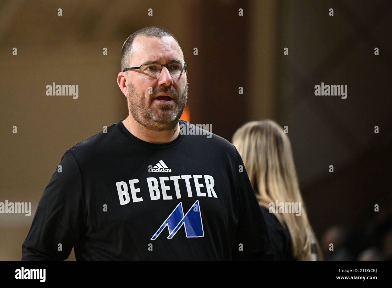 Mayville State Comets head coach Dennis Hutter walks the baseline ...