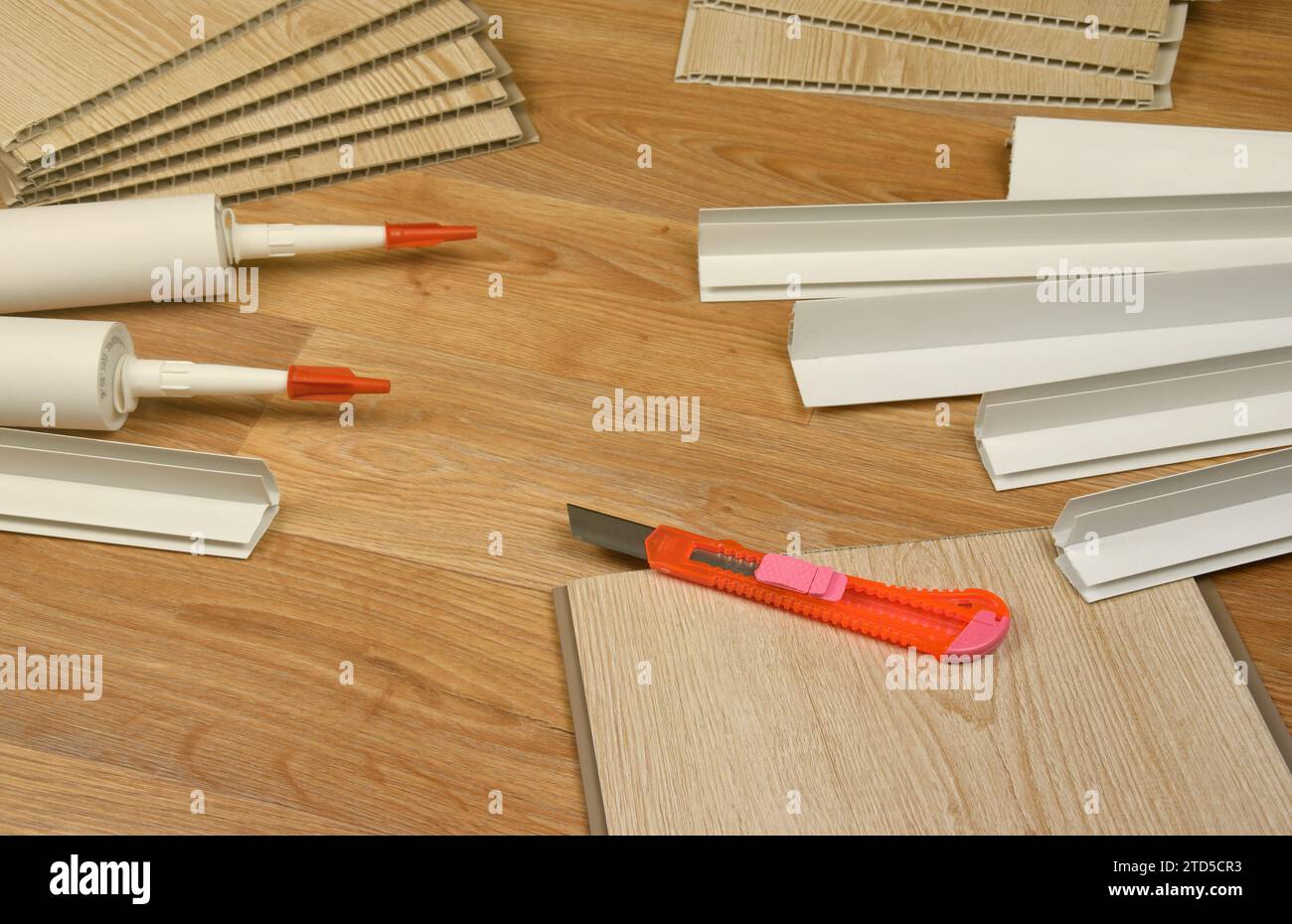 Set of items for PVC ceiling indoor works. Assembly adhesive bottles ...