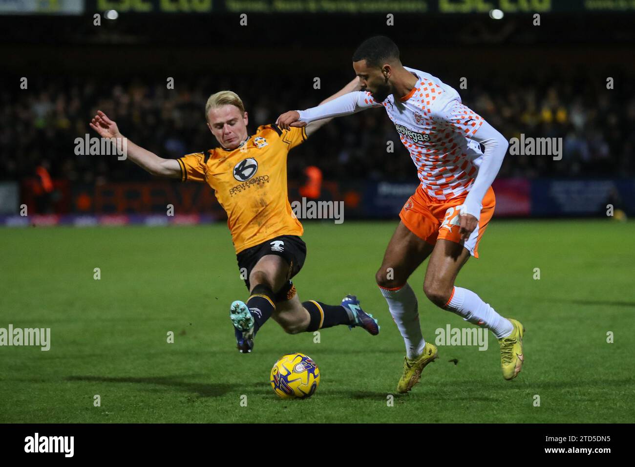 Liam Bennett #2 of Cambridge United tackles CJ Hamilton #22 of ...