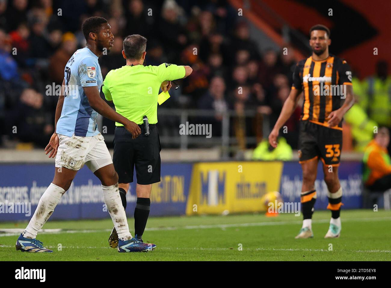 Cyrus Christie of Hull City is shown the yellow card during the Sky Bet ...
