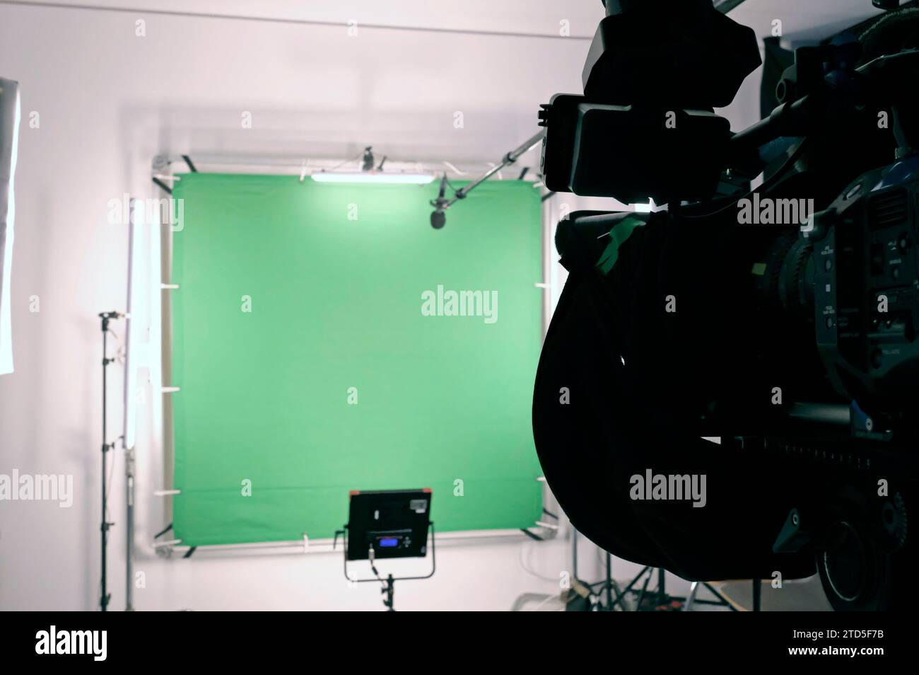 Setup in a TV studio with green screen, lights, and camera Stock Photo ...