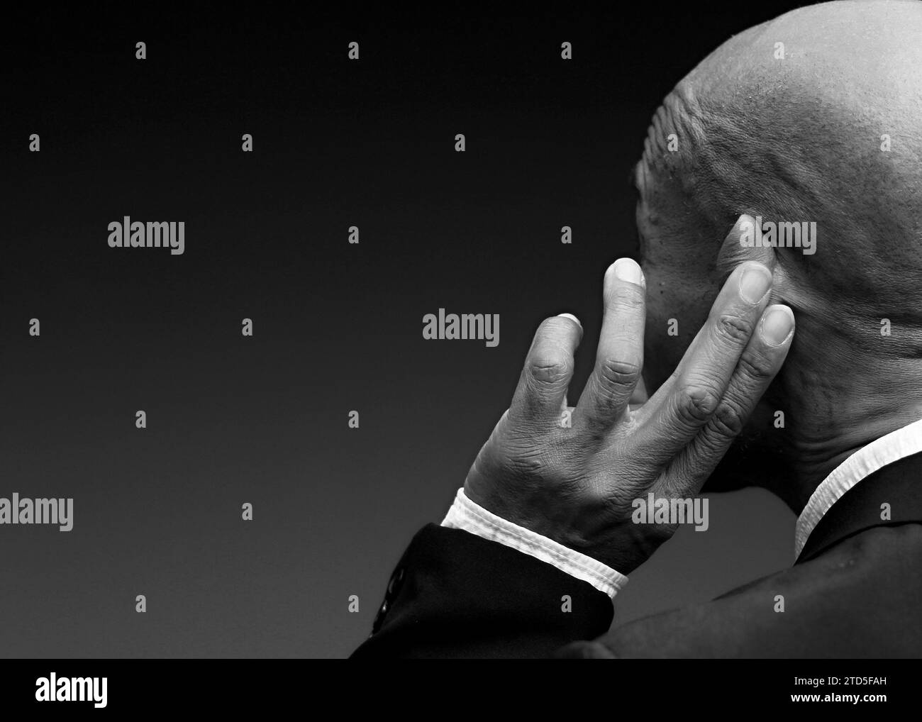 deafness suffering from hearing loss on grey black background with ...