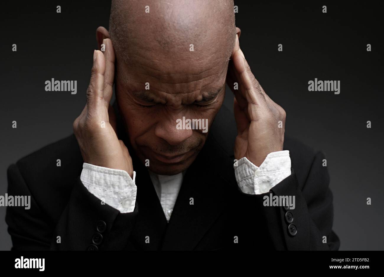 deafness suffering from hearing loss on grey black background with ...