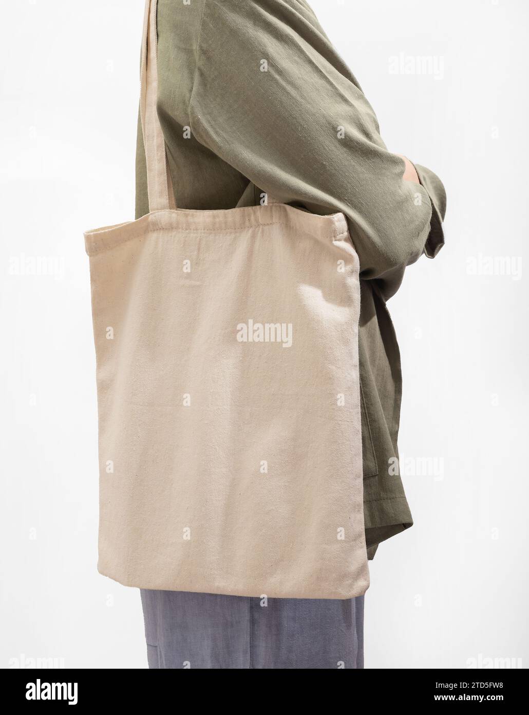 Carrying natural eco tote bag on shoulder. Woman with shopper isolated ...