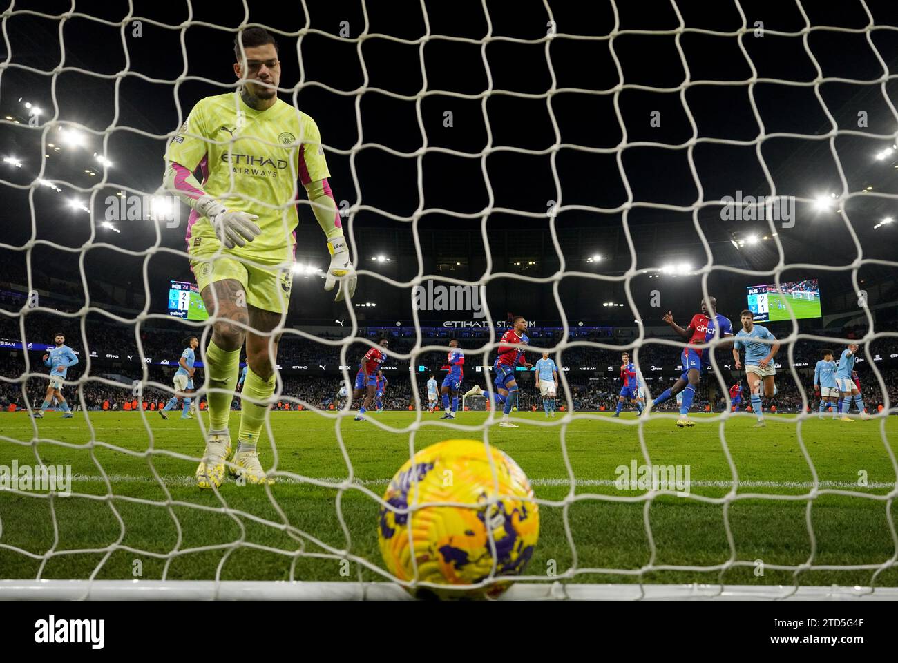 Manchester City goalkeeper Ederson collects the ball from his net after ...