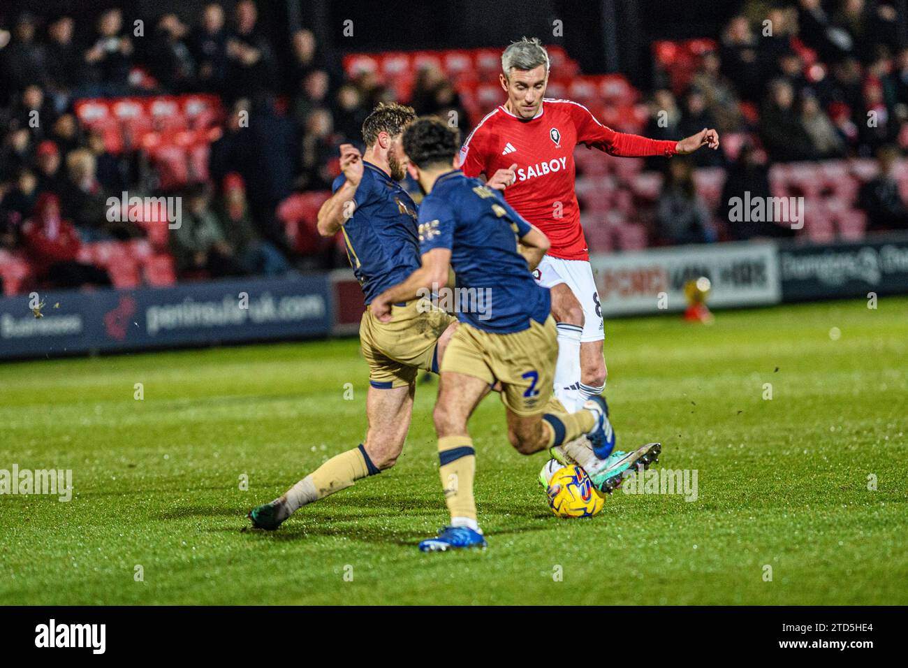 Salford, UK. 16th December 2023.Wimbledon's Huseyin Biler (2) and Joe ...