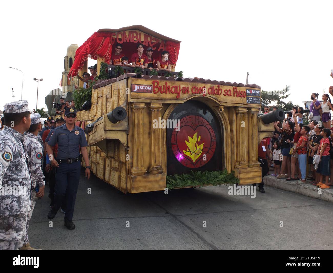 The casts of the movie seen inside their float of the historical drama ...