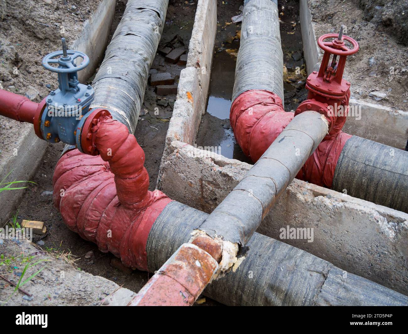 New pipes and taps for urban heating communications Stock Photo - Alamy