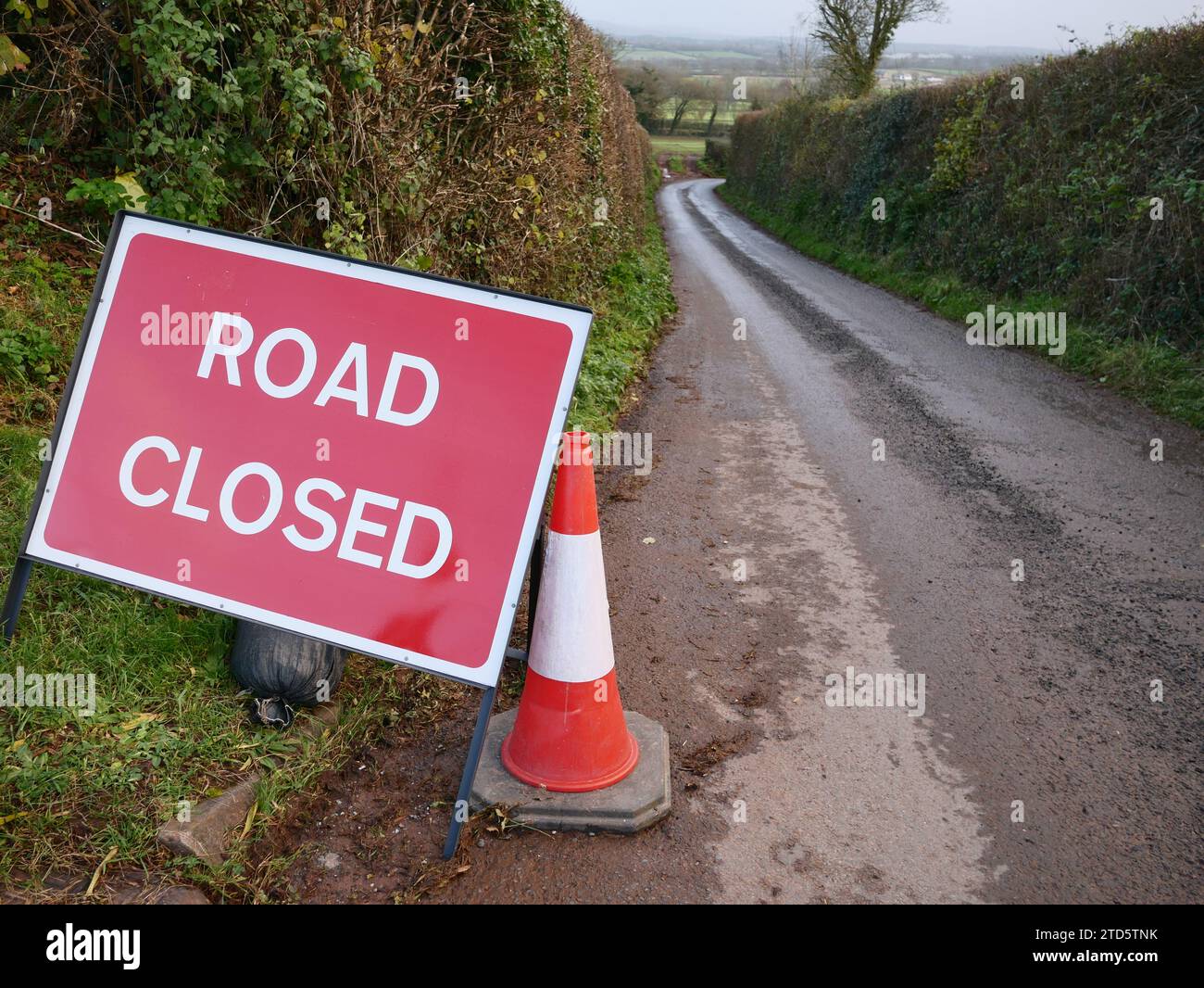 Road closed sign and bollard beside a narrow country lane Stock Photo ...