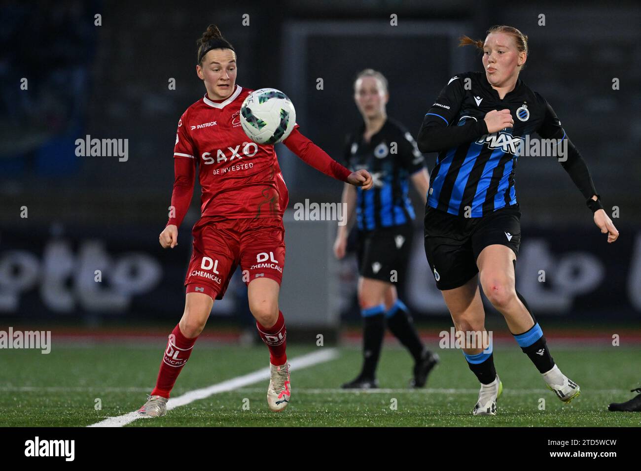 Elke Van Gorp (14) of Zulte-Waregem pictured fighting for the ball with Margaux Martle (16) of ...