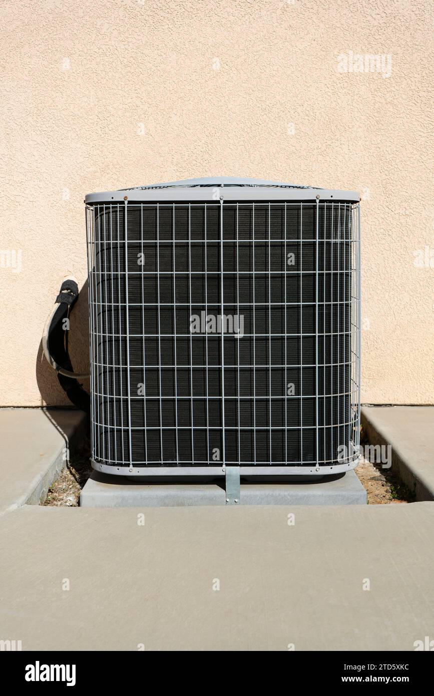An outdoor air conditioning condenser unit near house Stock Photo - Alamy