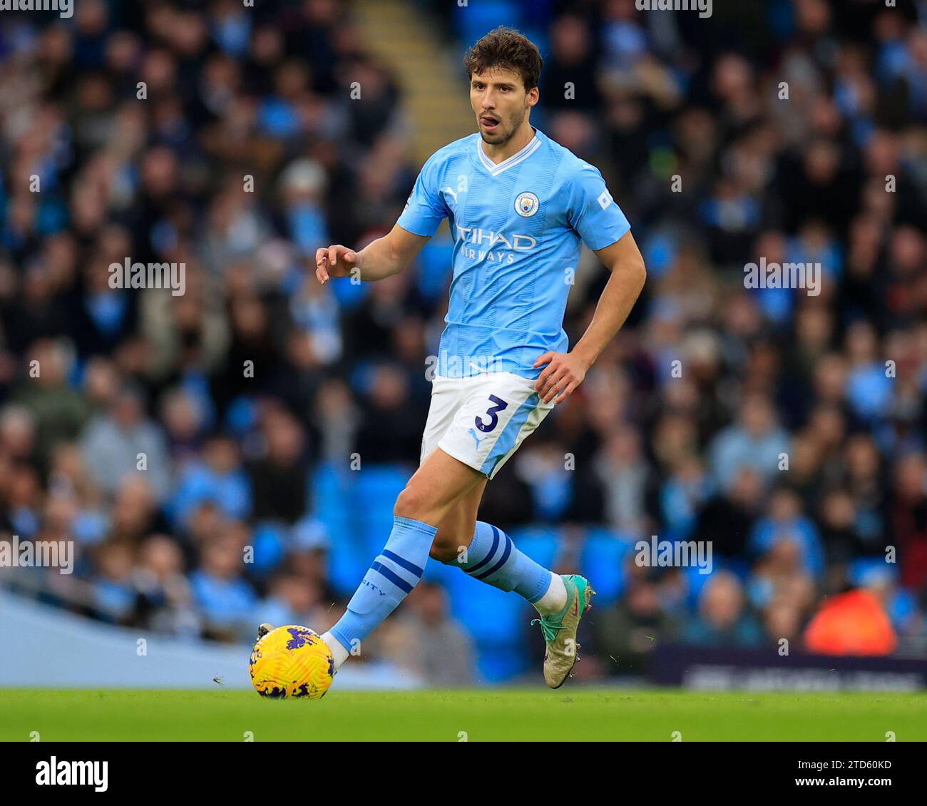 Ruben Dias #3 of Manchester City controls the ball during the Premier ...