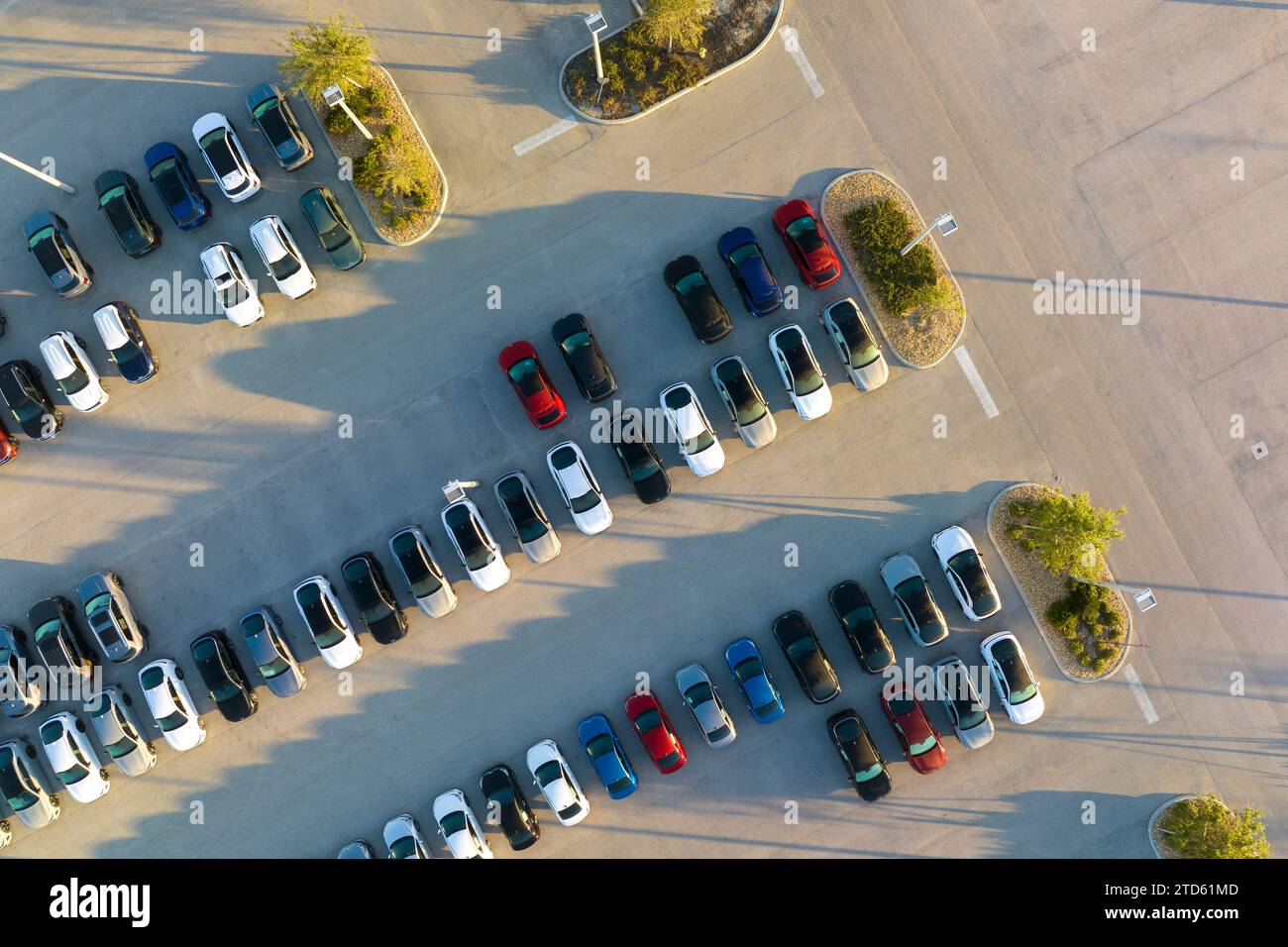 Aerial view of dealership parking lot with many brand new cars for sale ...