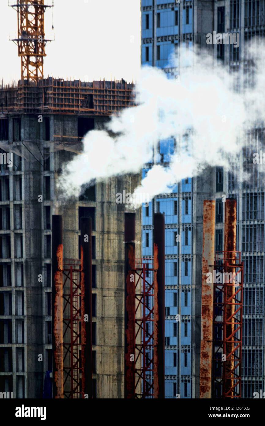 heat power station, steam billows from power plant. Thick clouds of ...