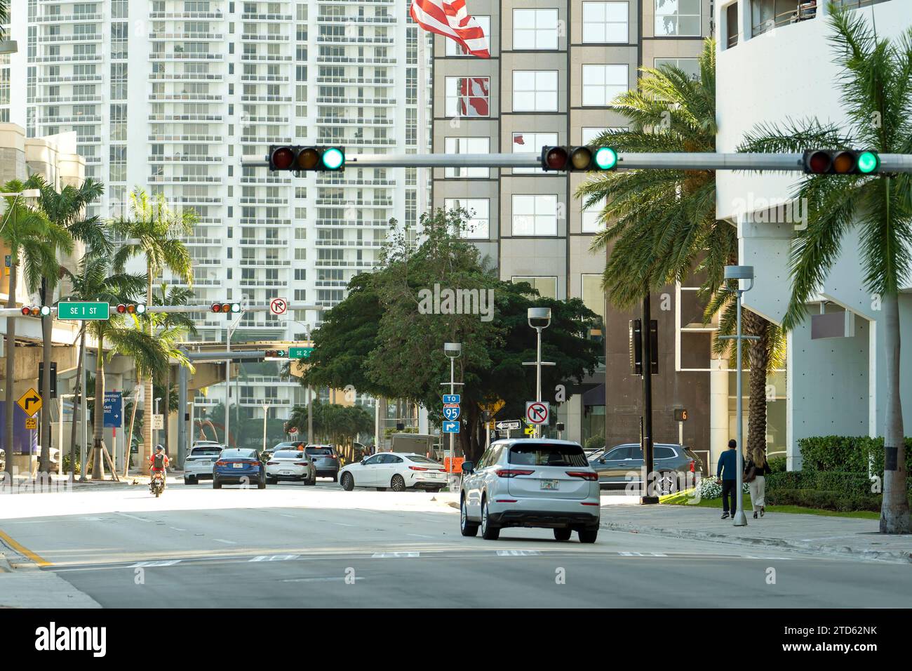 Cars traffic driving at intersection on American street with traffic ...