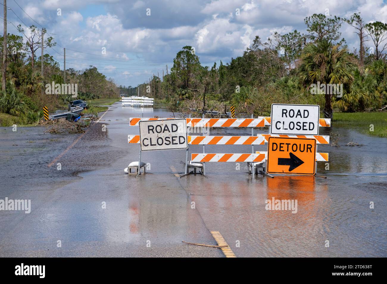 Flooded street in Florida after hurricane rainfall with road closed ...