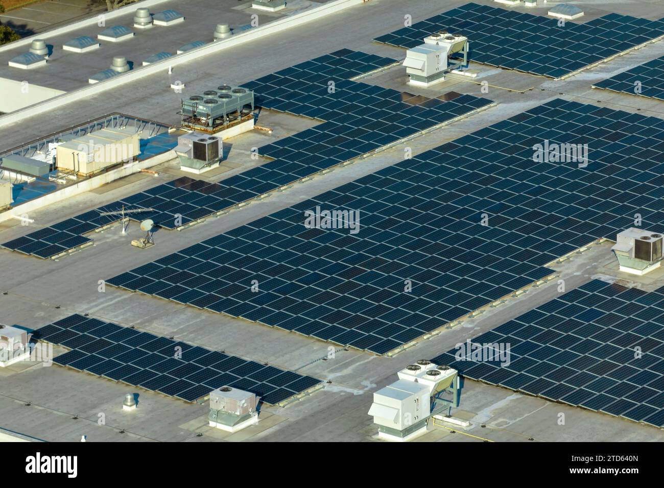Photovoltaic solar panels mounted on industrial building roof for ...