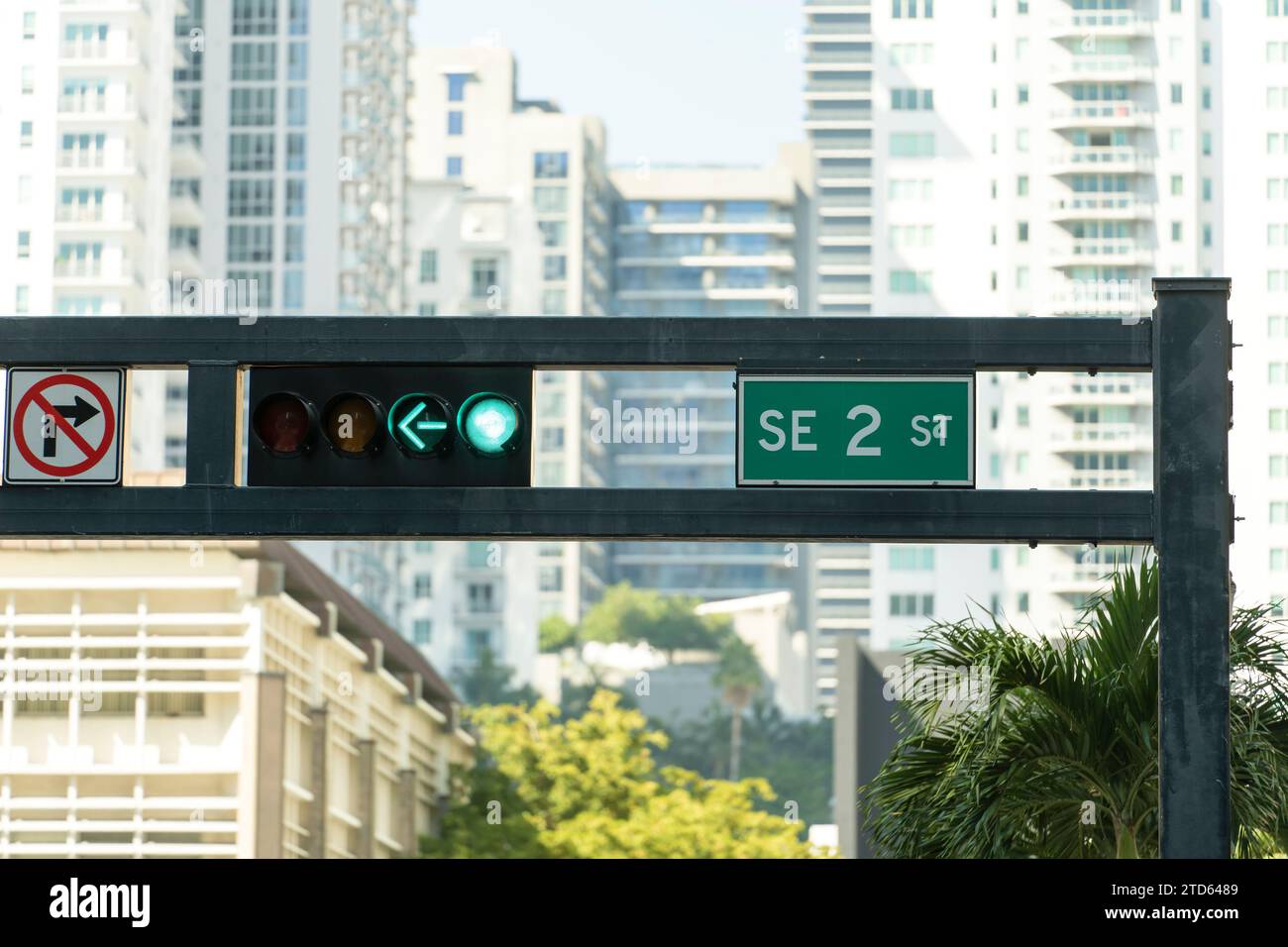 Traffic lights regulating driving cars on city street in Miami, Florida ...