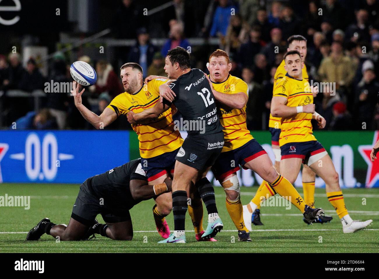 Ulster's Stuart McCloskey (second from left) is tackled by Racing 92's ...