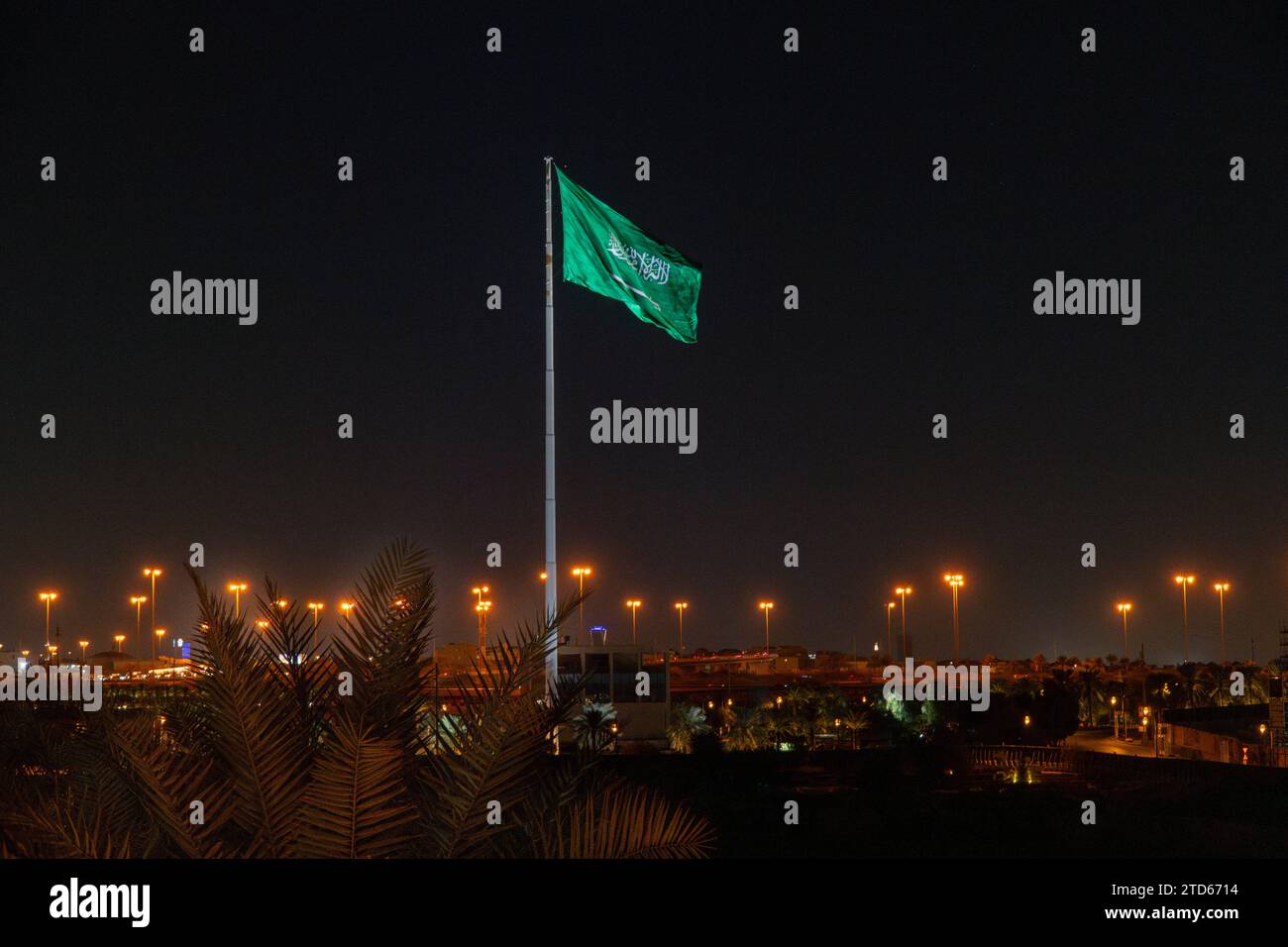 A large flag of the Kingdom of Saudi Arabia is seen flying near Riyadh ...