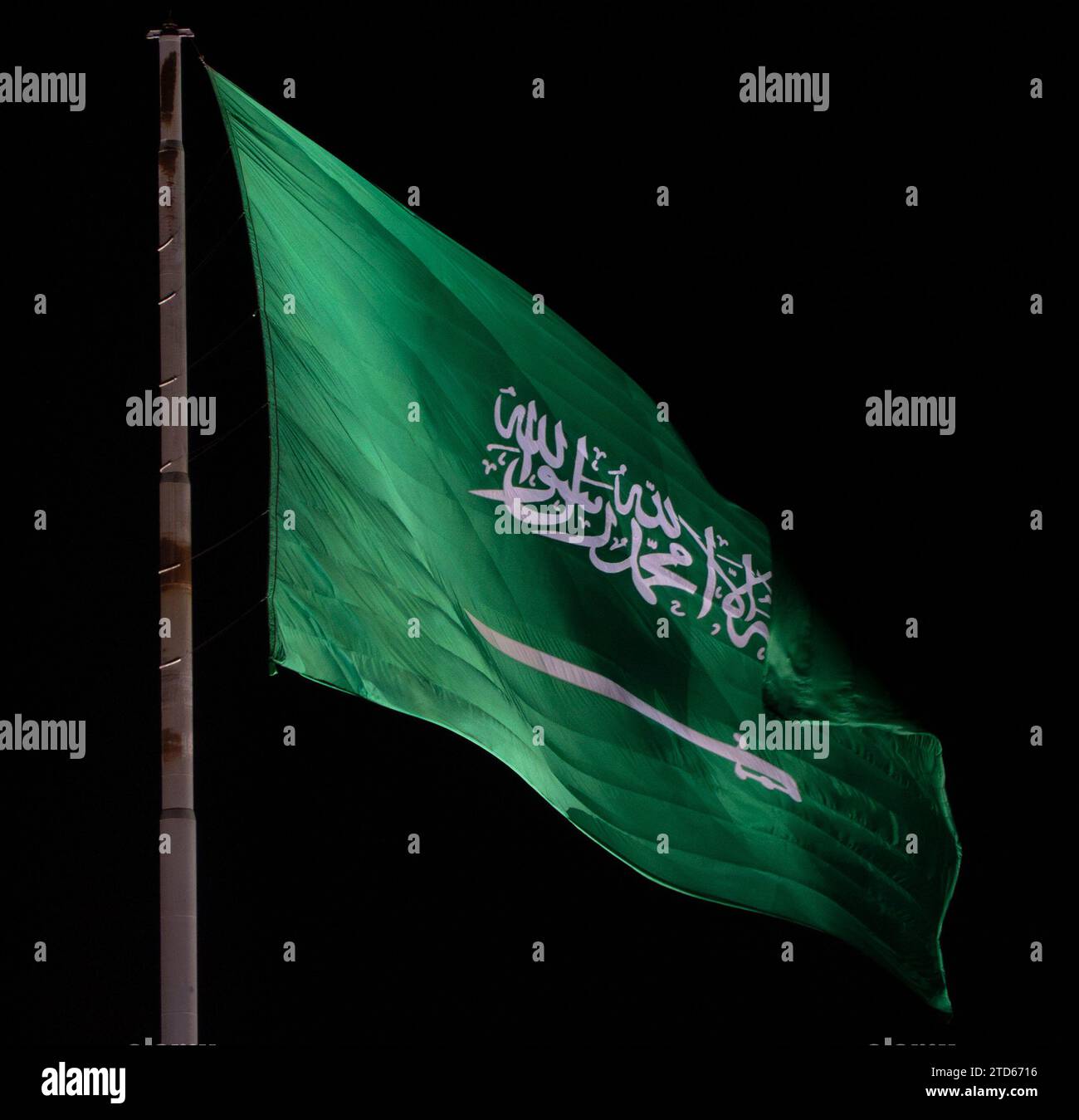 A large flag of the Kingdom of Saudi Arabia is seen flying near Riyadh ...