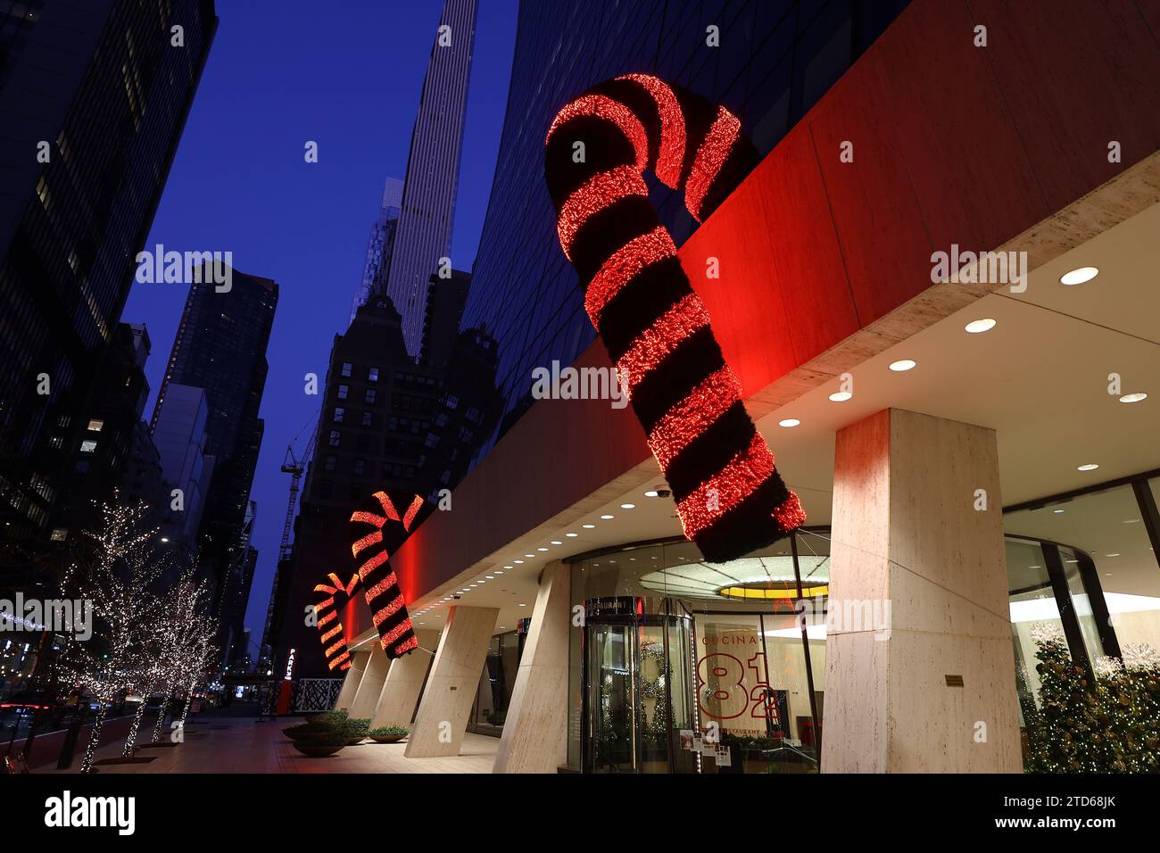 Giant candy canes hang outside an office building on W. 57th Street in ...
