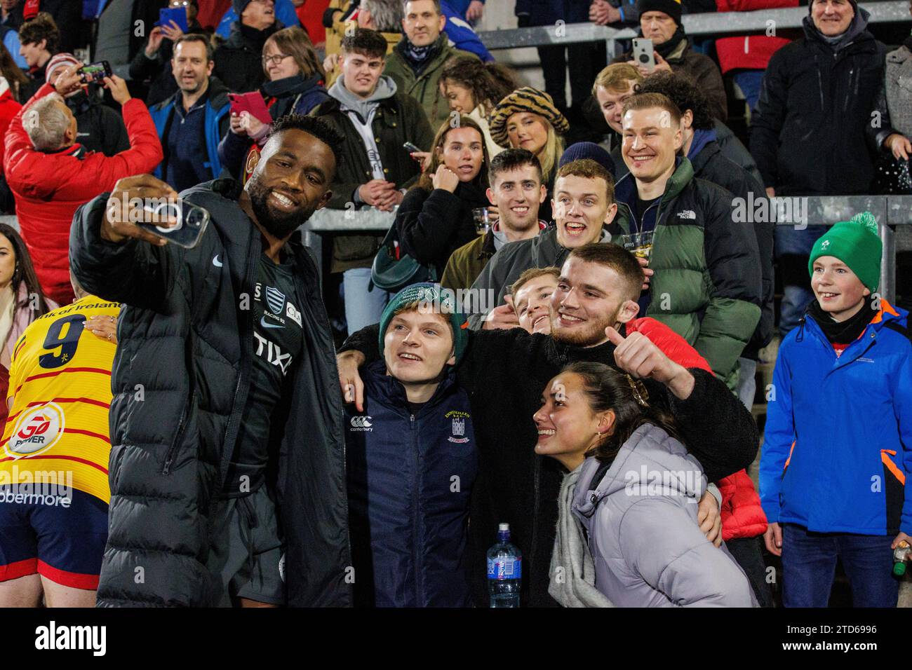 Racing 92's Siya Kolisi takes a photo with fans after the Investec ...