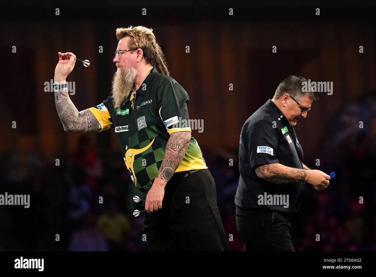 Simon Whitlock in action against Gary Anderson (right) on day two of ...