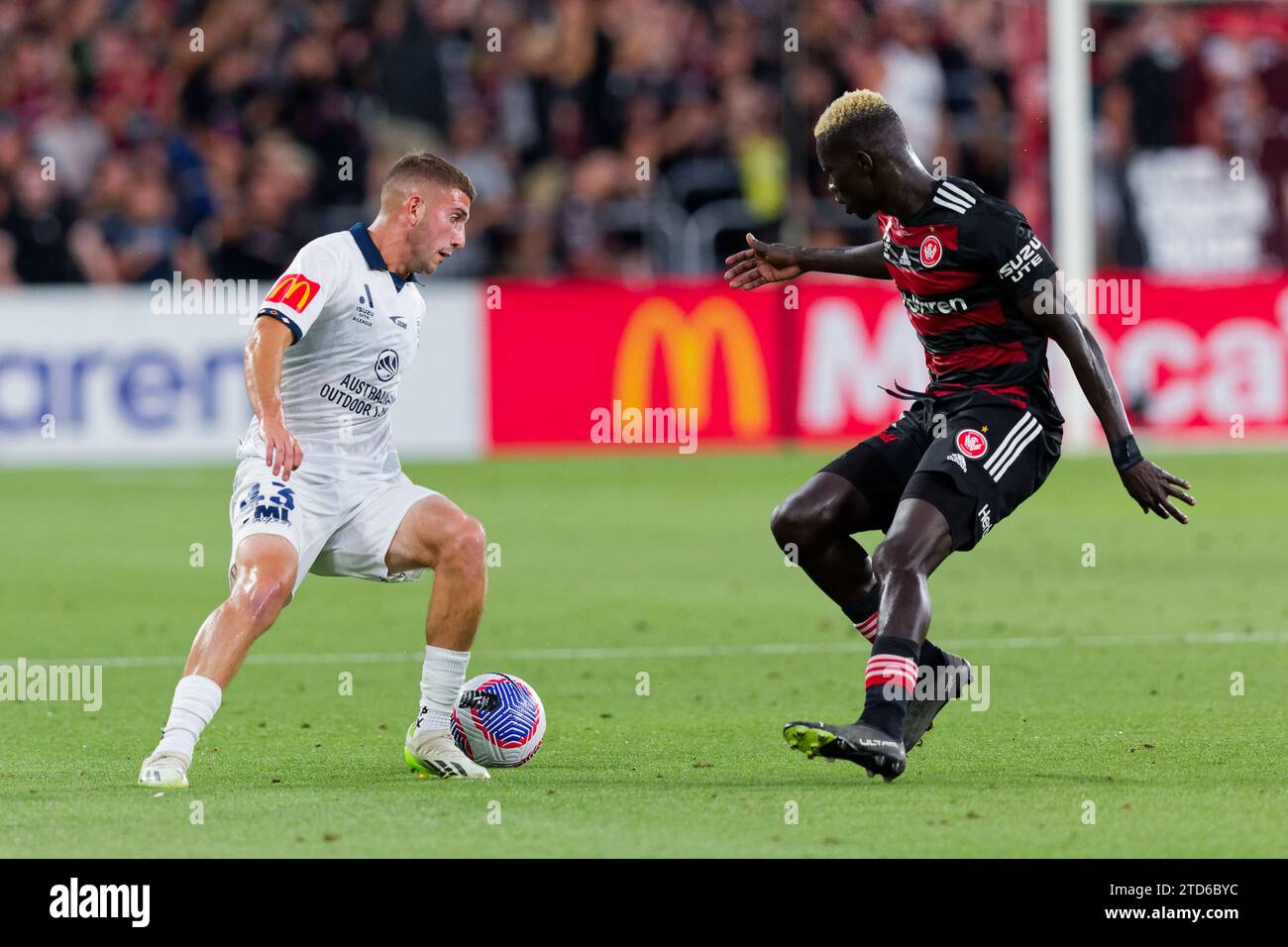 Valentino Yuel of the Wanderers competes for the ball with Giuseppe ...