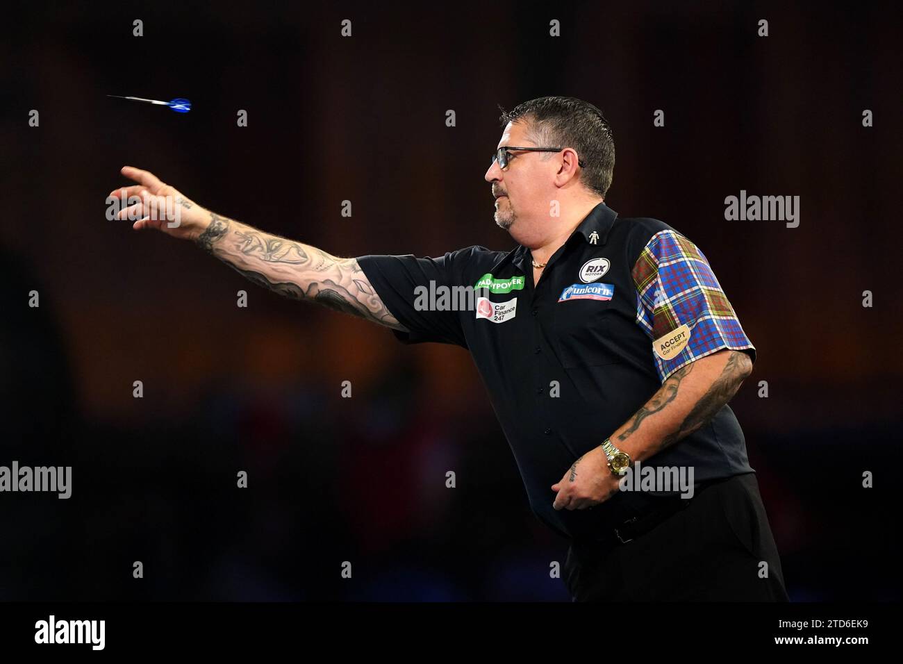 Gary Anderson in action against Simon Whitlock (not pictured) on day ...