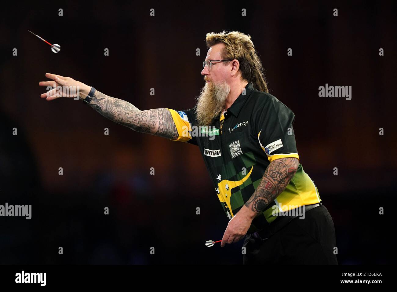 Simon Whitlock in action against Gary Anderson (not pictured) on day ...