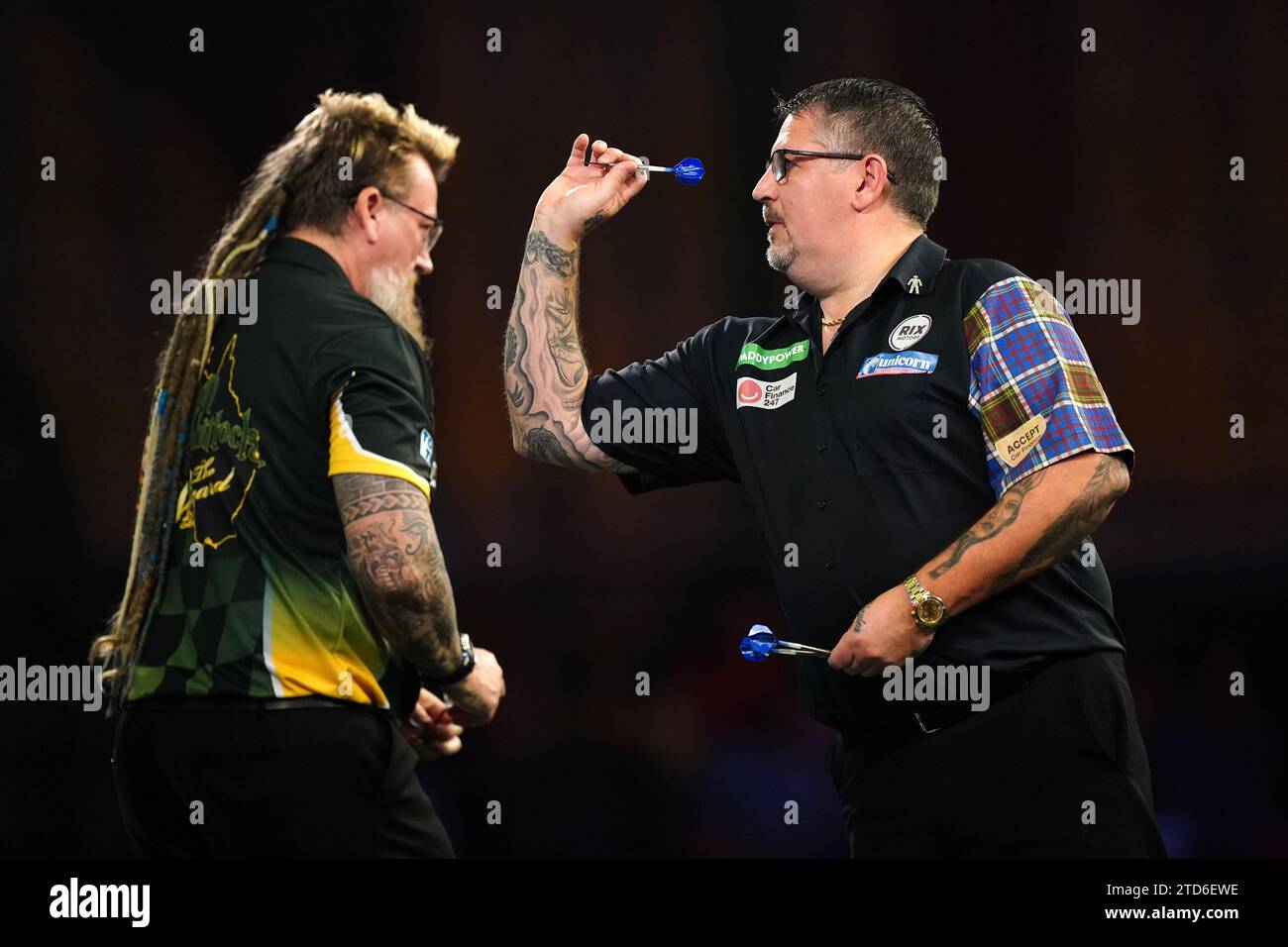 Gary Anderson in action against Simon Whitlock (not pictured) on day ...
