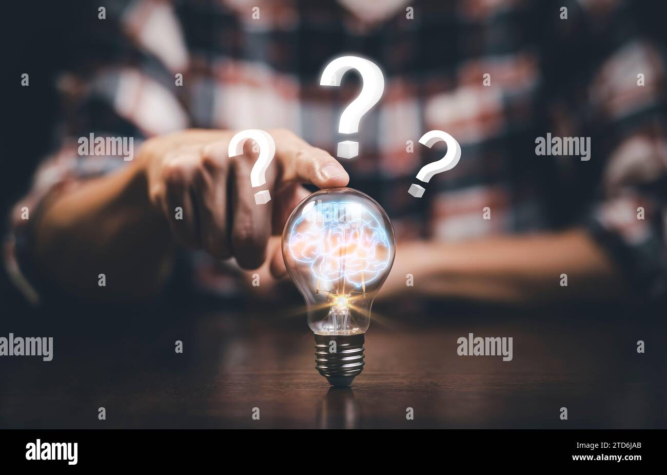 Light bulb with brain icon and Question mark on the dark background ...