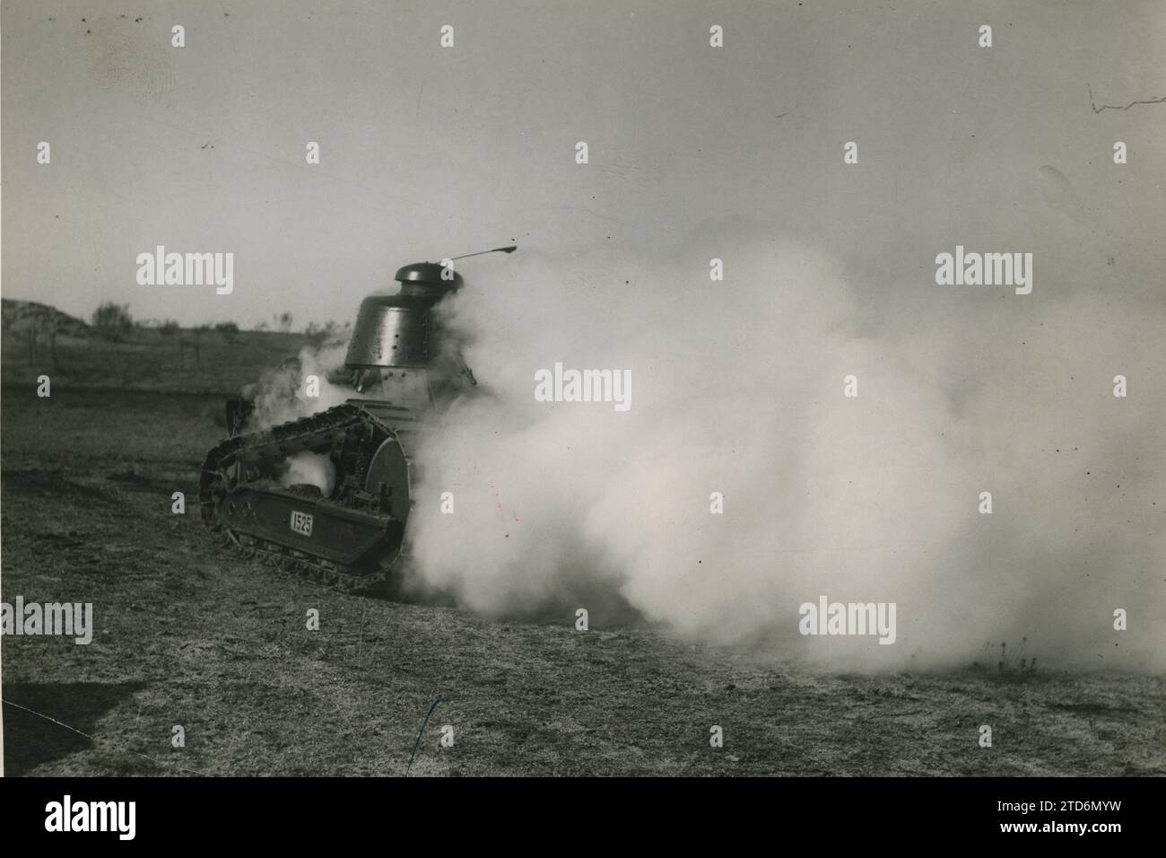 Madrid, around 1932. An infantry tank launching a smoke screen to hide ...