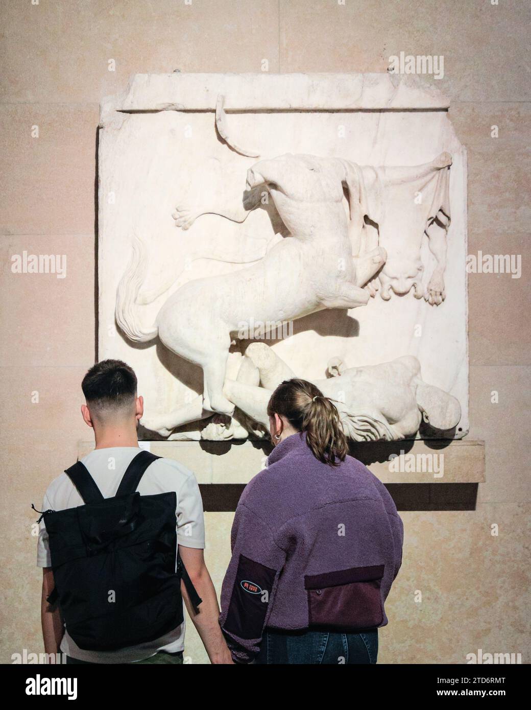 London, UK. 16th Dec, 2023. Tourists and visitors admire sculptures from the east pediment ...