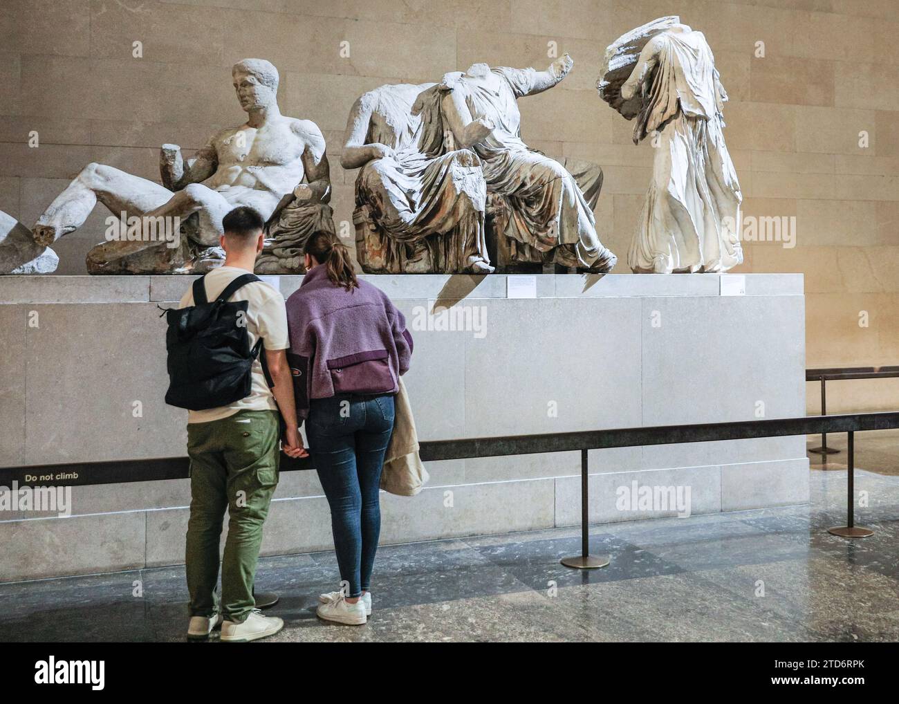 London, UK. 16th Dec, 2023. Tourists and visitors admire sculptures from the east pediment ...