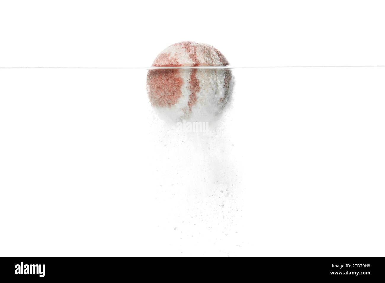 Bath bomb in water on white background Stock Photo - Alamy