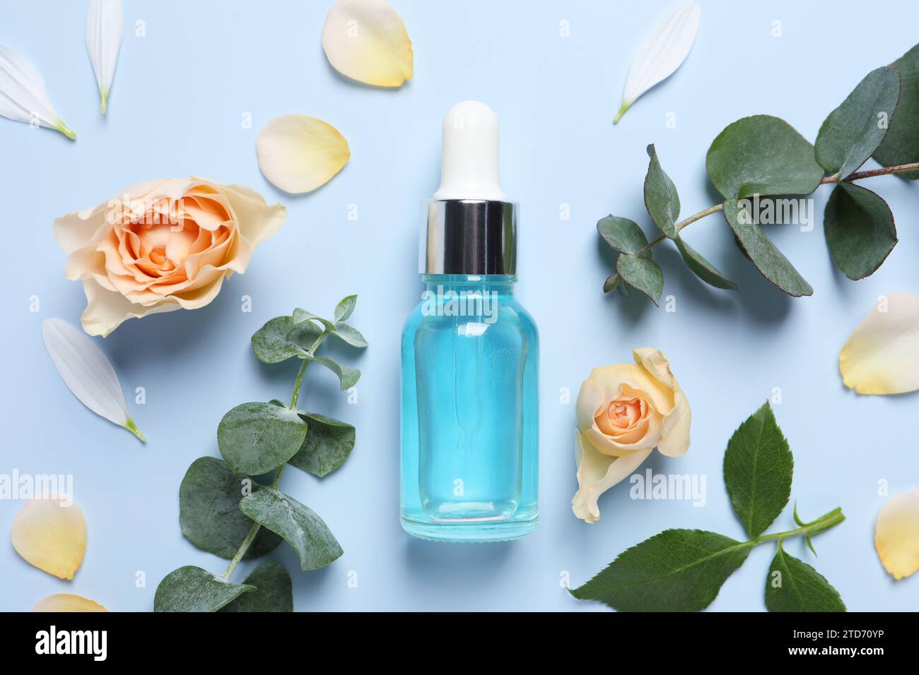 Flat lay composition with cosmetic serum on light blue background Stock ...