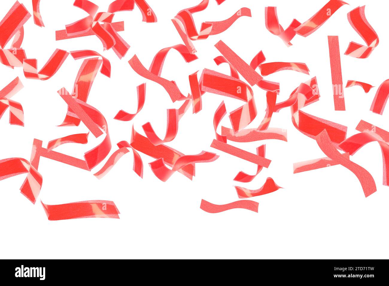 Bright red confetti falling on white background Stock Photo - Alamy