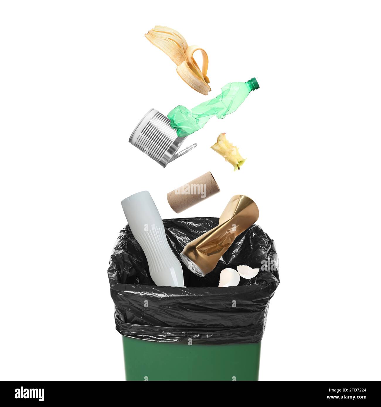 Garbage falling into trash bin on white background Stock Photo - Alamy
