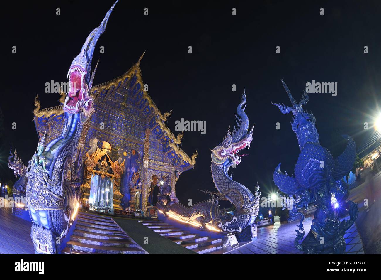 Night of Serpent front of the beauty blue chapel at Wat Rong Suea Ten ...