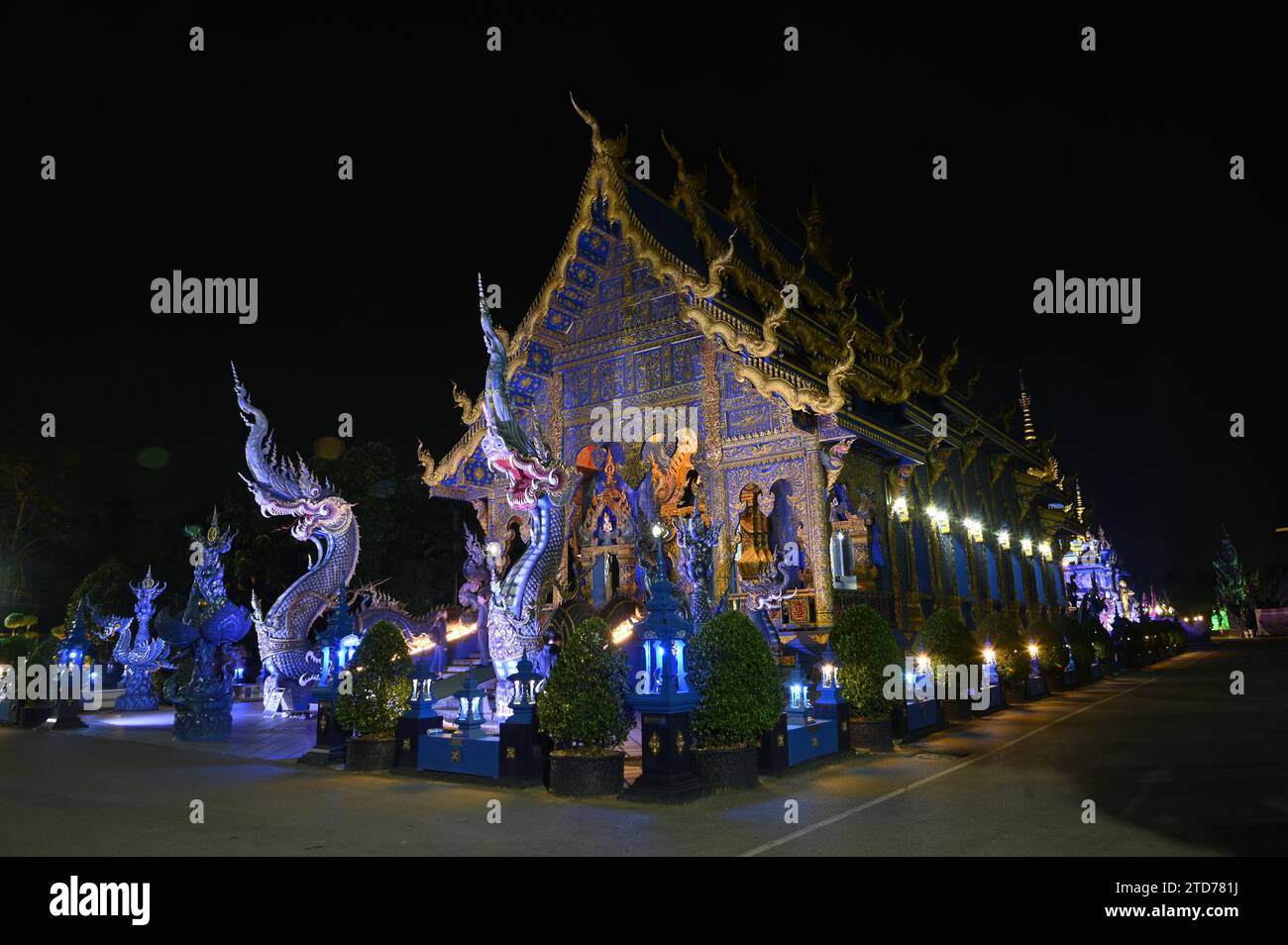 Night of Serpent front of the beauty blue chapel at Wat Rong Suea Ten ...