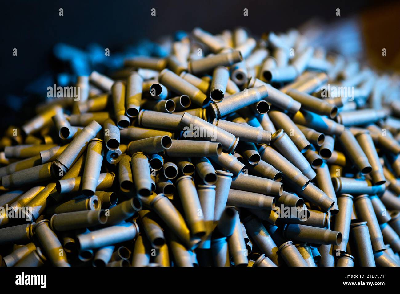 Bullet casings pile in weapon production plant storage Stock Photo - Alamy