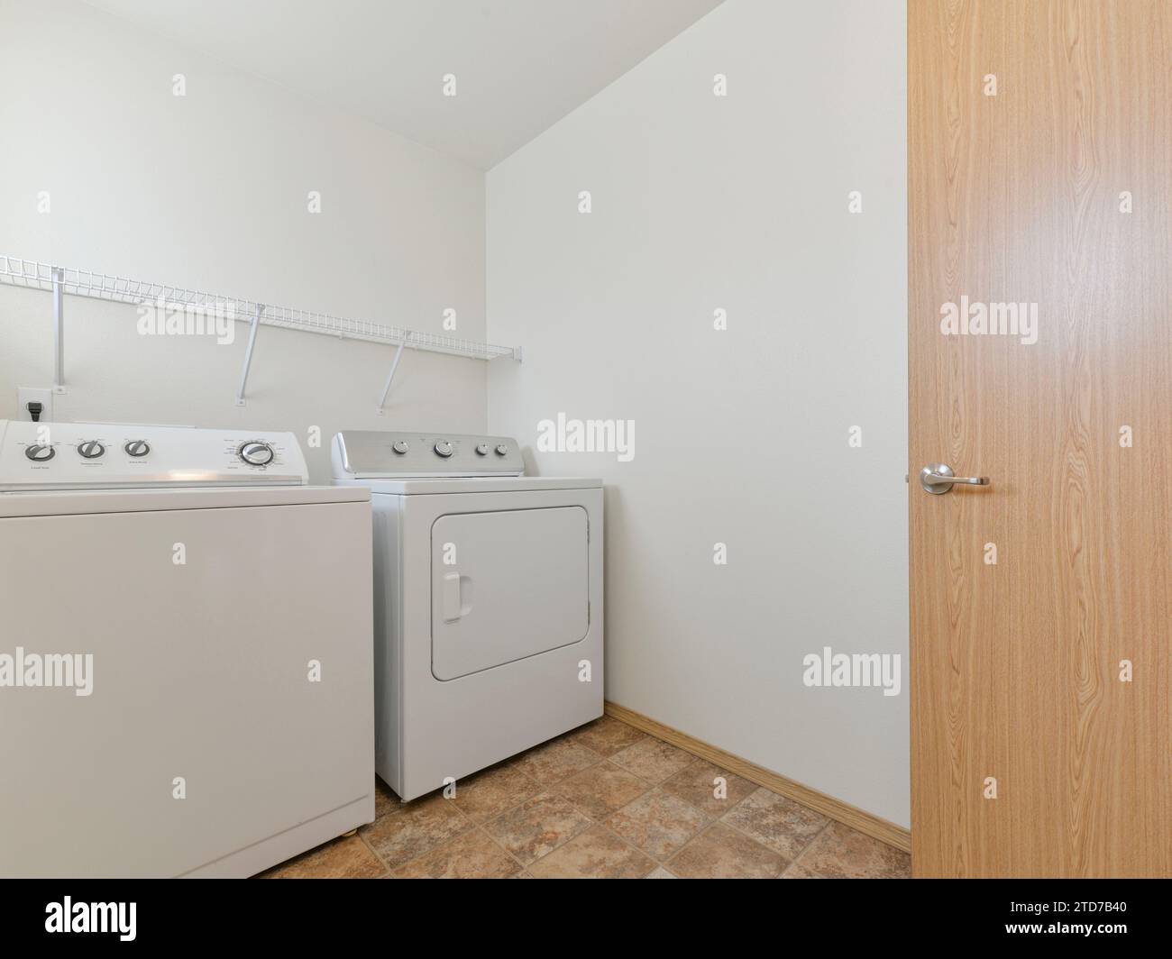 Modern residential laundry room interior Stock Photo - Alamy