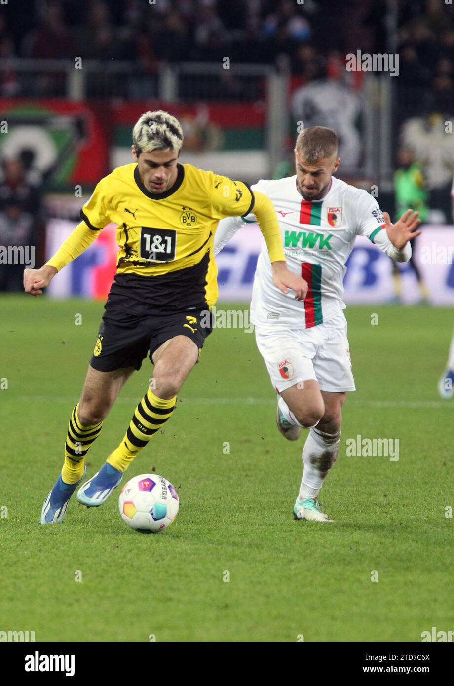 AUGSBURG, Germany - 16. December 2023: 7 Giovanni Alejandro REYNA vs #30 Niklas DORSCH during ...