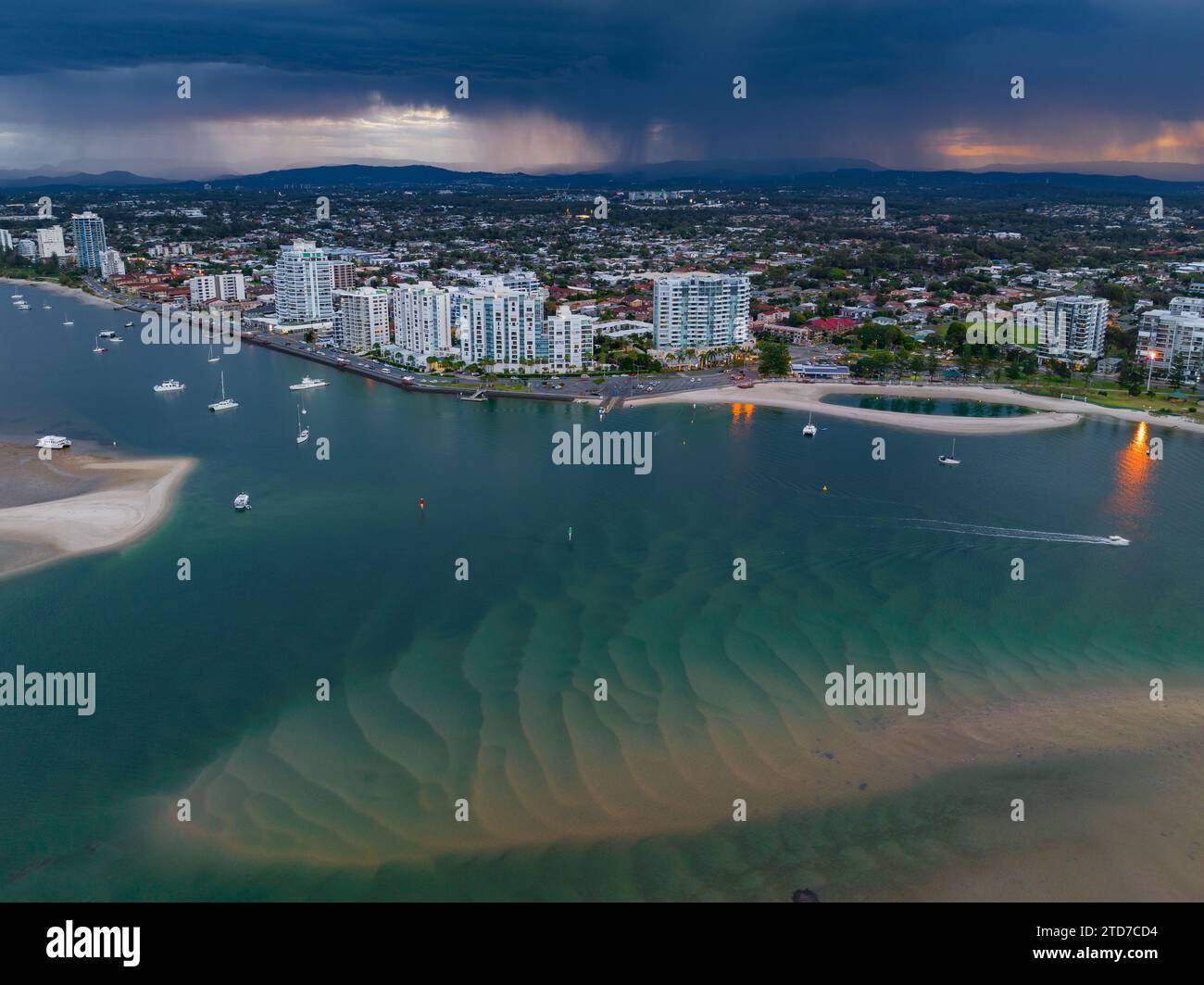 High rise waterfront real estate with a dark stormfront moving in ...